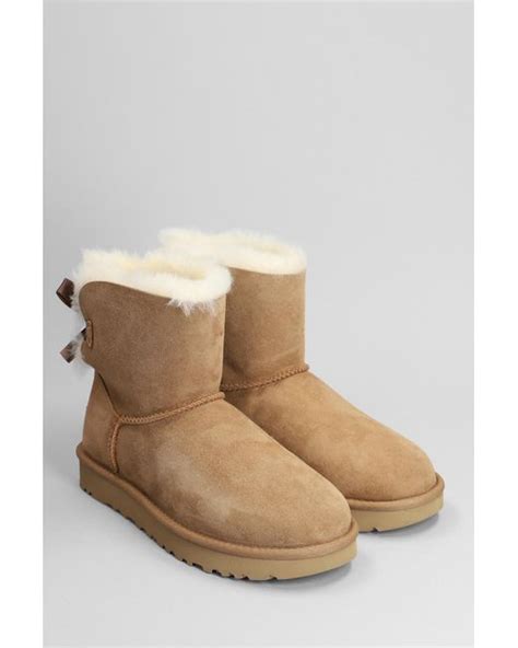 Ugg Mini Bailey Bow Ii Low Heels Ankle Boots In Leather Color Suede In Brown Lyst