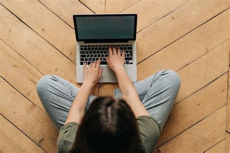Premium Photo Top View Of An Unrecognizable Woman Working On A Laptop