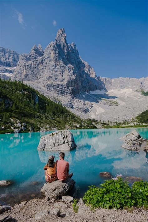 Couple Of Men And Women Visiting Lago Di Sorapis In The Italian