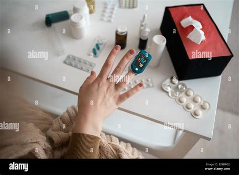 Adult Woman S Hand With Pulse Oximeter Attached To The Fingertip People Measure Heart Rate