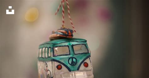 A Blue And White Bus Ornament Hanging From A String Photo Free Usa