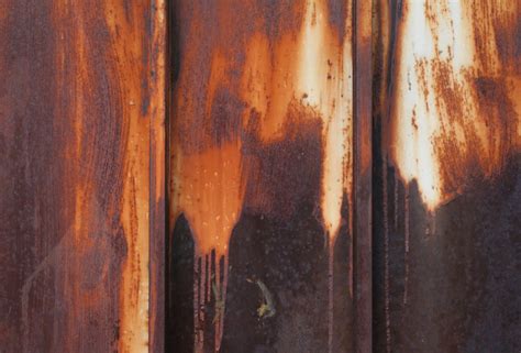 Rusty Metal Surface With Orange And Brown Hues Free Stock Photo