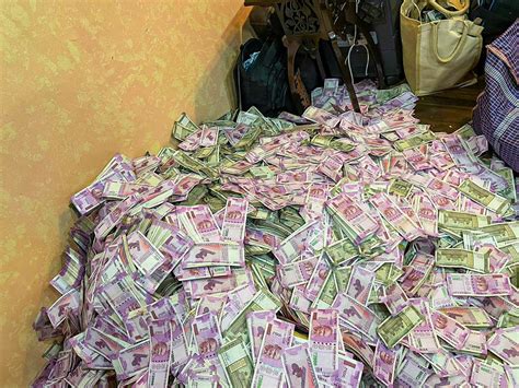 Ed Raids Dozens In Bengal Including 2 Ministers Seizes Rs 20 Cr In