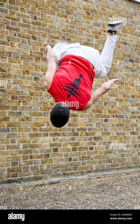 MODEL RELEASED Man Jumping In Mid Air Man Performing A Back Flip