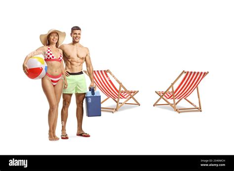 Young Couple In Swimming Suits Standing Near Beach Chairs Isolated On