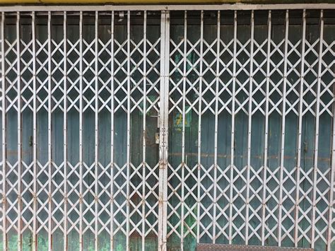 Premium Photo Metal Fence Against Building