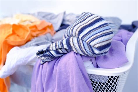 Colorful Clothes Randomly Lying Around In Mesh Basket Close Up Mess