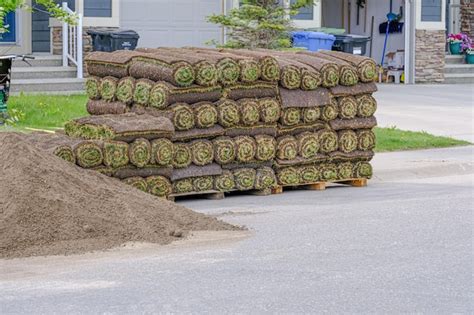 Premium Photo Stack Of Rolled Grass Sod Or Turf For Landscaping