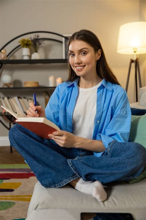Woman Penning Diary On Sofa In House Beautiful Brunette Relaxing Indoors Stock Image Image Of