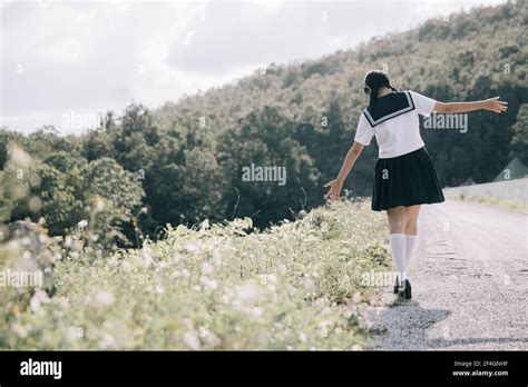 Portrait Of Asian Japanese School Girl Costume Walking At Park Outdoor