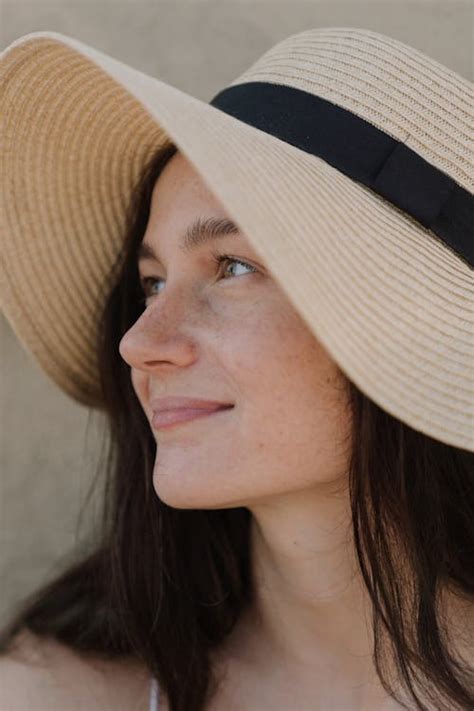 Woman In Black And White Floral Shirt Wearing Brown Fedora Hat · Free