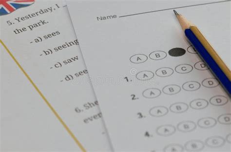 English Test And Bubble Answer Sheet On Table In Class Stock Image