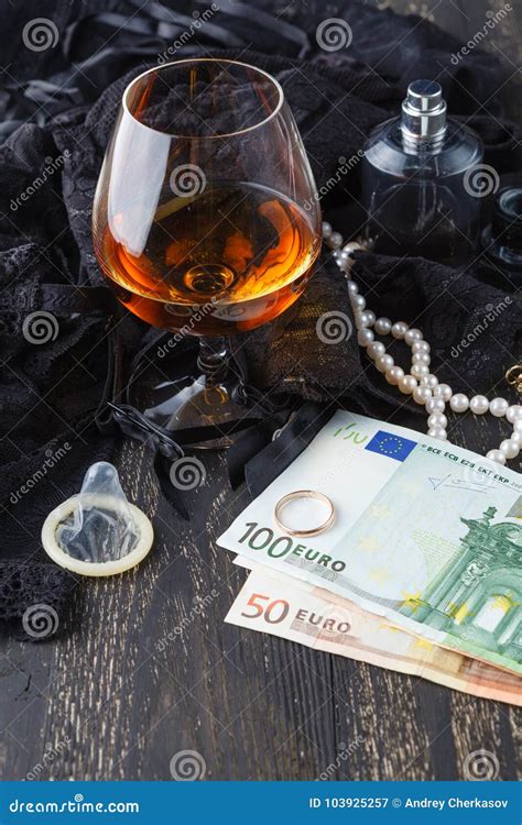 Underwear Cognac And Money To Symbolize The Cost Of Sex Stock Image