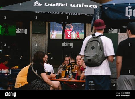 People Sit Outside Enjoy Public Viewing In A Restaurant In Cologne