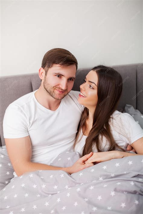 Premium Photo Happy Sensual Young Couple Lying In Bed Together