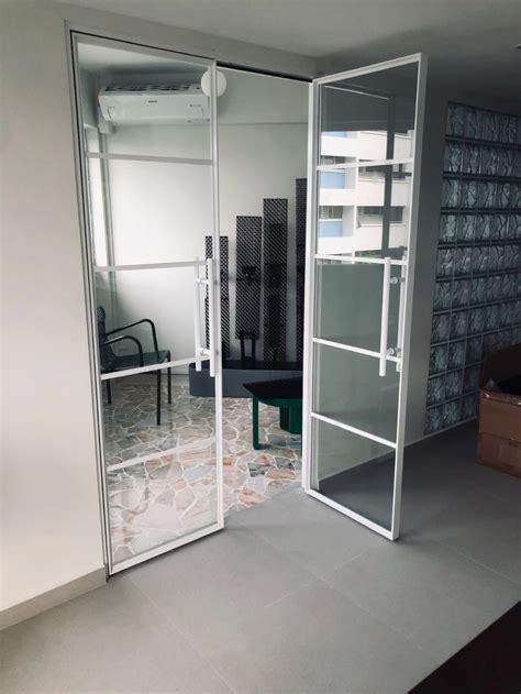 Elegant Double Interior Glass Doors With Lattice Design At Meeting Room