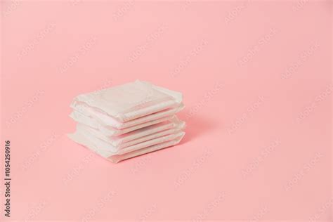 Sanitary Pads Packed On Pink Background Concept Of Menstruation