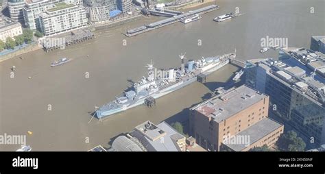 An Aerial View Of The Hms Belfast Town Class Light Cruiser In The Water