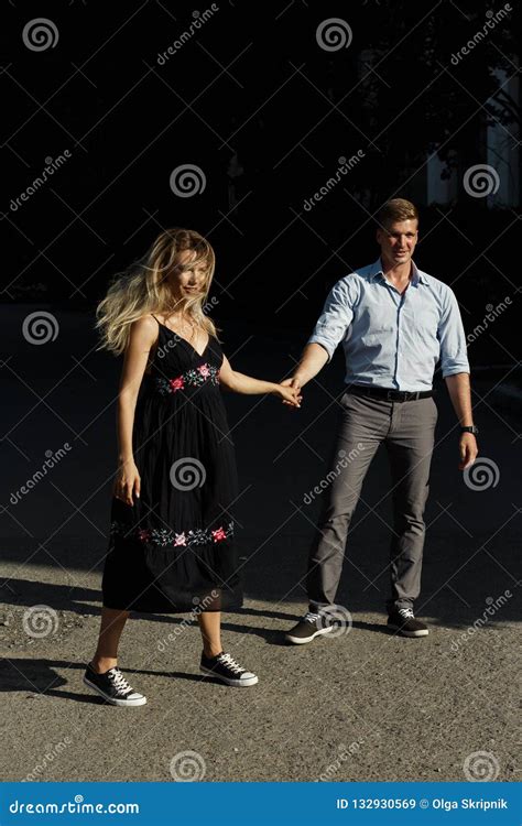 Black Background Loving And Happy Couple Dancing On The Street Stock