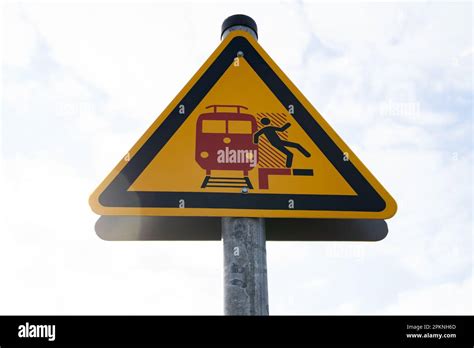 Triangular Yellow Warning Sign On The Platform Meaning Beware Of