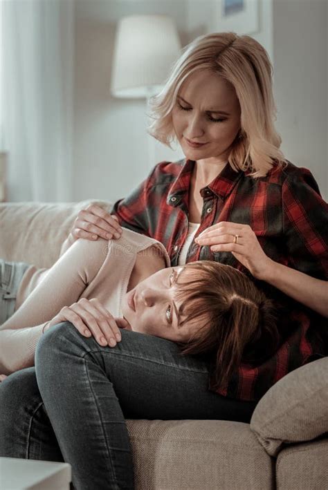 Beautiful Thoughtful Girl Caressing Her Brunet Partner Stock Image