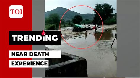 Watch Bus With 50 Passengers Loses Balance Falls In Flooded Drain
