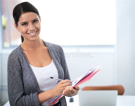Shes The New Editor Portrait Of A Young Design Professional Holding