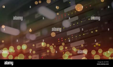 Image Of Computer Language And Falling Lens Flares Over Multiple Modems