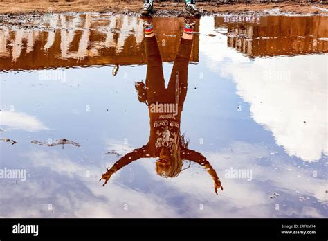 Wacken Germany 05th Aug 2023 A Woman Is Reflected In A Mud Puddle