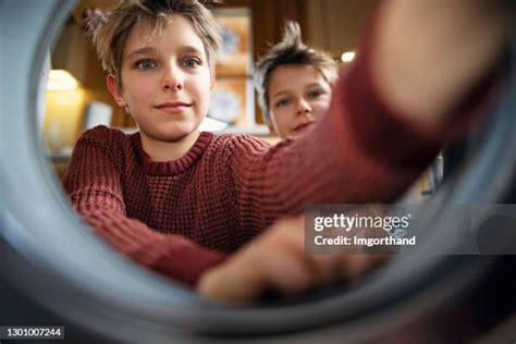 Boy Washing Machine Photos And Premium High Res Pictures Getty Images