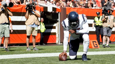 Download Tyrod Taylor Takinga Knee During Game Wallpaper