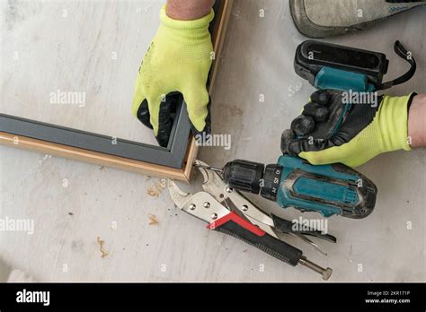 Drilling A Hole In The Door Frame For A Corner Connection Installation Of Interior Doors Stock