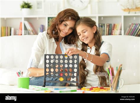 Girl Playing With Her Mother Stock Photo Alamy