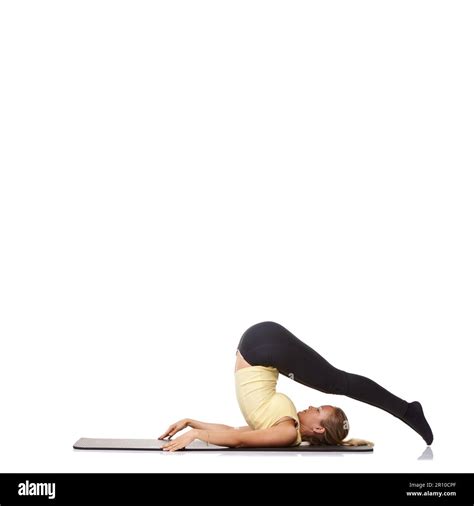 Flexibility And Fitness A Fit Young Woman Lying On Her Back And
