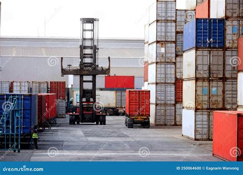 Forklift Truck Handling Cargo Container Boxes In Logistic Delivery Yard With Stacks Of Cargo