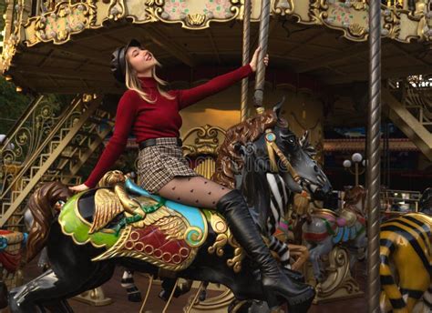Naughty Girl In The Amusement Park Rides On A Swing Stock Image Image