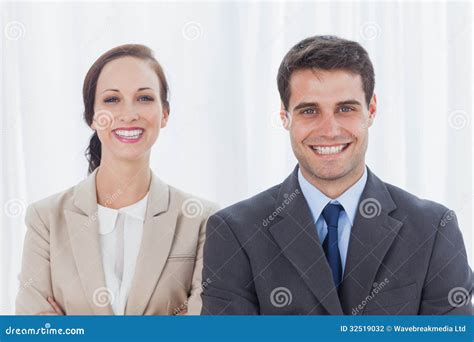 Cheerful Partners Posing Together Looking At Camera Stock Photo Image