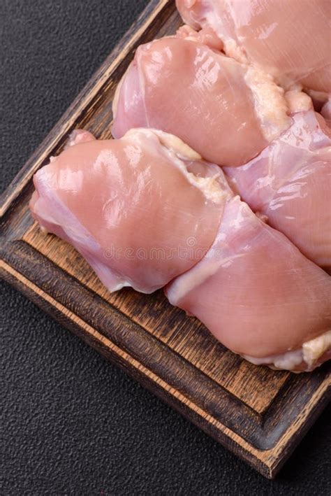 Fresh Raw Chicken Thigh Fillets With Salt Spices And Herbs Stock Image