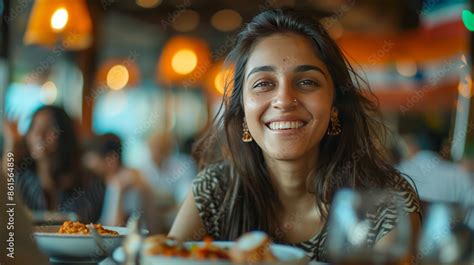 South Asian Girl Enjoying Idli Sambhar In An Authentic South Indian