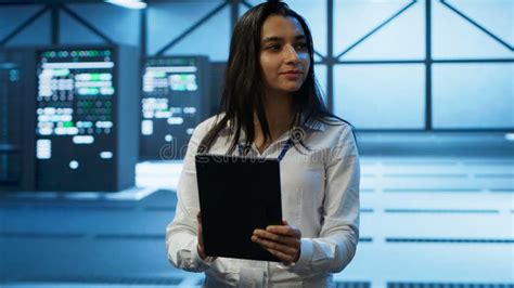 Admin In Data Center Monitoring Security Threats With Tablet Stock