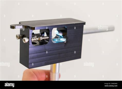 Scientist Checking The Condition Of Nebulizer Needle From Lc Ms Qtof System Using Adjustment
