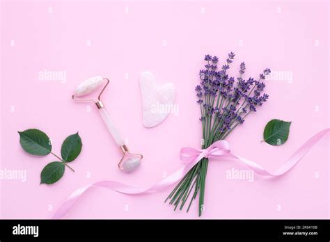 Quartz Face Roller On Pink Background Top View Facial Massage Tool