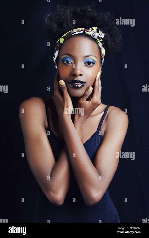 Shes A True African Beauty A Beautiful African Woman Posing Against A