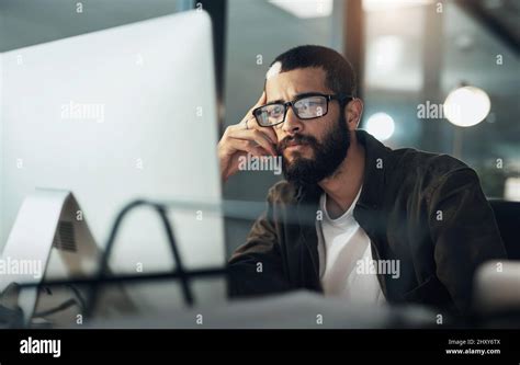 The Later It Gets The Deeper He Goes Shot Of A Young Businessman Using