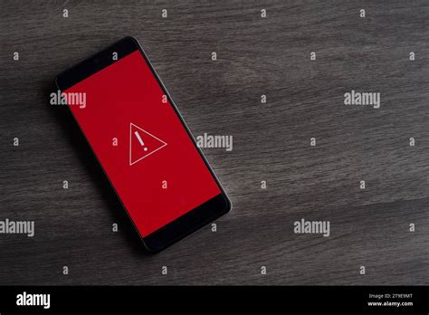 Smartphone With Triangle Caution Warning Icon Copy Space For Text