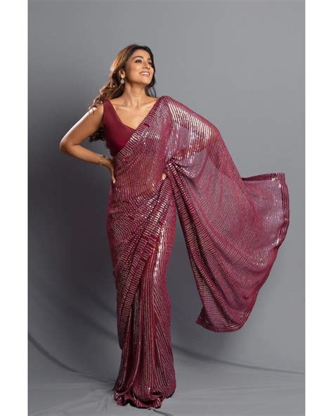 Kriti Sanon In Tangerine Sequins Saree And Shriya Saran In Magenta Pink