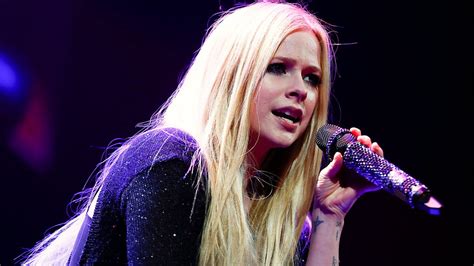 Avril Lavigne Poses In Thigh High Boots And Bralette As She Shares New