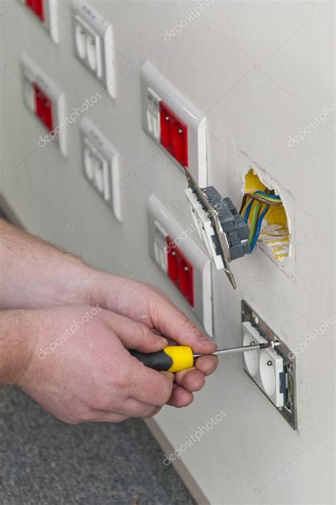 Removing The Electrical Socket Stock Photo By Antos