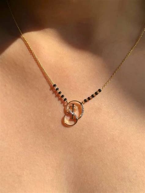 A Symbol Of Marriage And Love In 2024 Black Beads Mangalsutra Design
