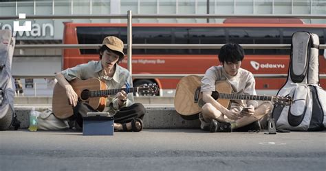 Man Wearing Gray Dress Shirt Playing Acoustic Guitar On Street Photo